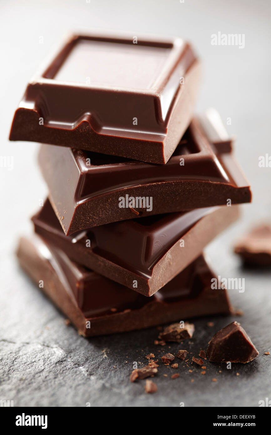 Stack of milk chocolate pieces hi-res stock photography and images - Alamy