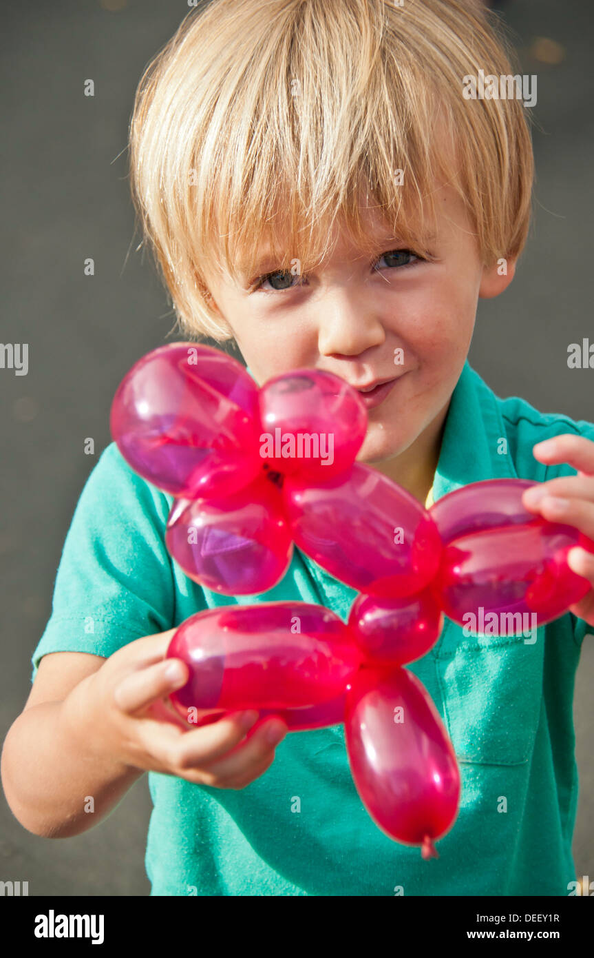 Child and balloons hi-res stock photography and images - Alamy