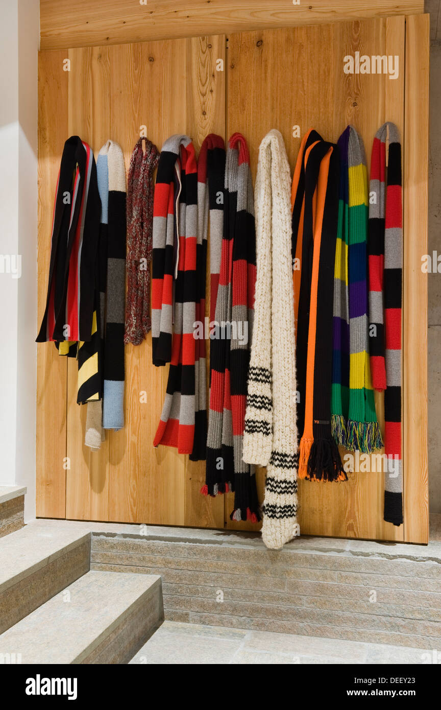 Swiss boot room with a collection of striped scarves representing ...