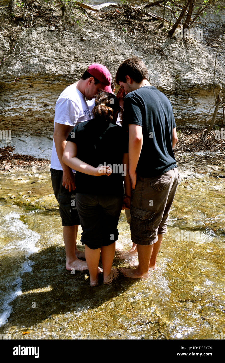 Group stands together in water Stock Photo - Alamy