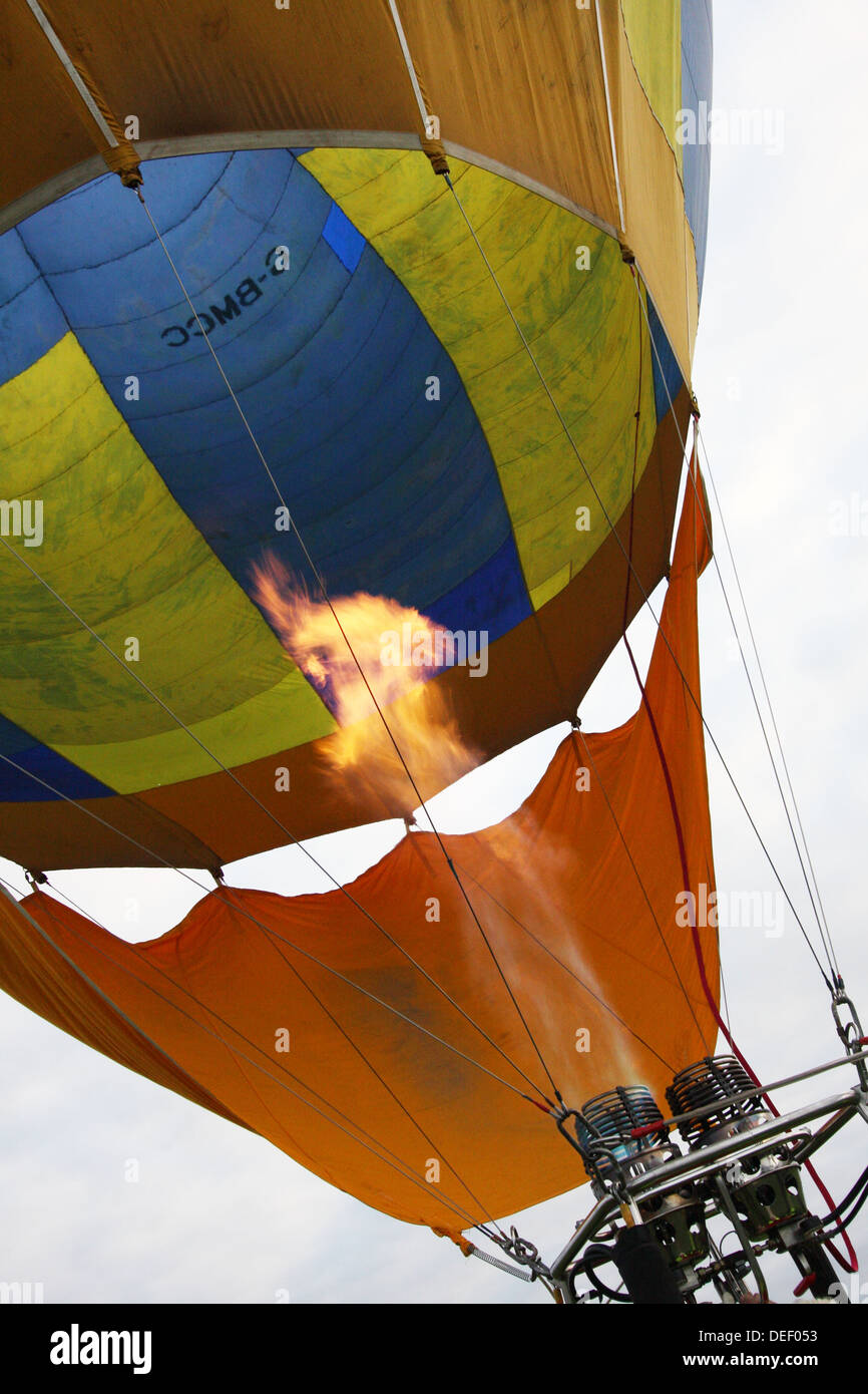 Flame from burner inflating hot air balloon Stock Photo - Alamy