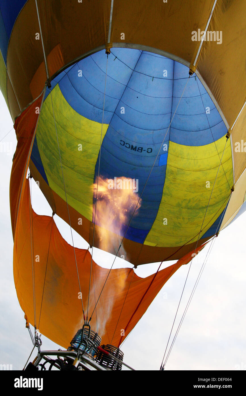 Flame from burner inflating hot air balloon Stock Photo - Alamy