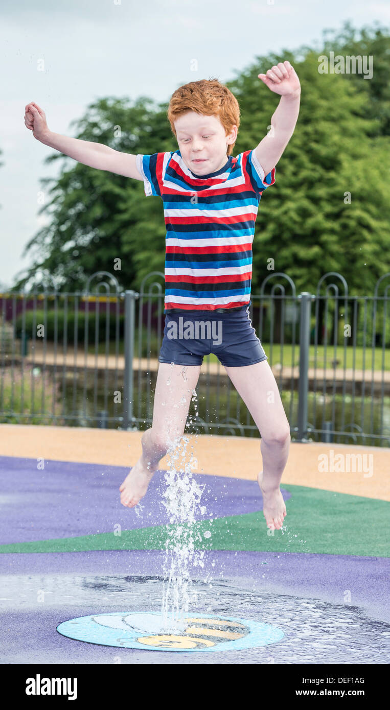 Children playing in water park hi-res stock photography and images - Alamy