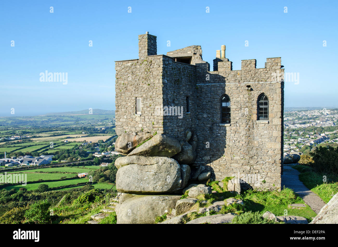 Carn Brea castle looks down on the town of Redruth in Cornwall Stock ...