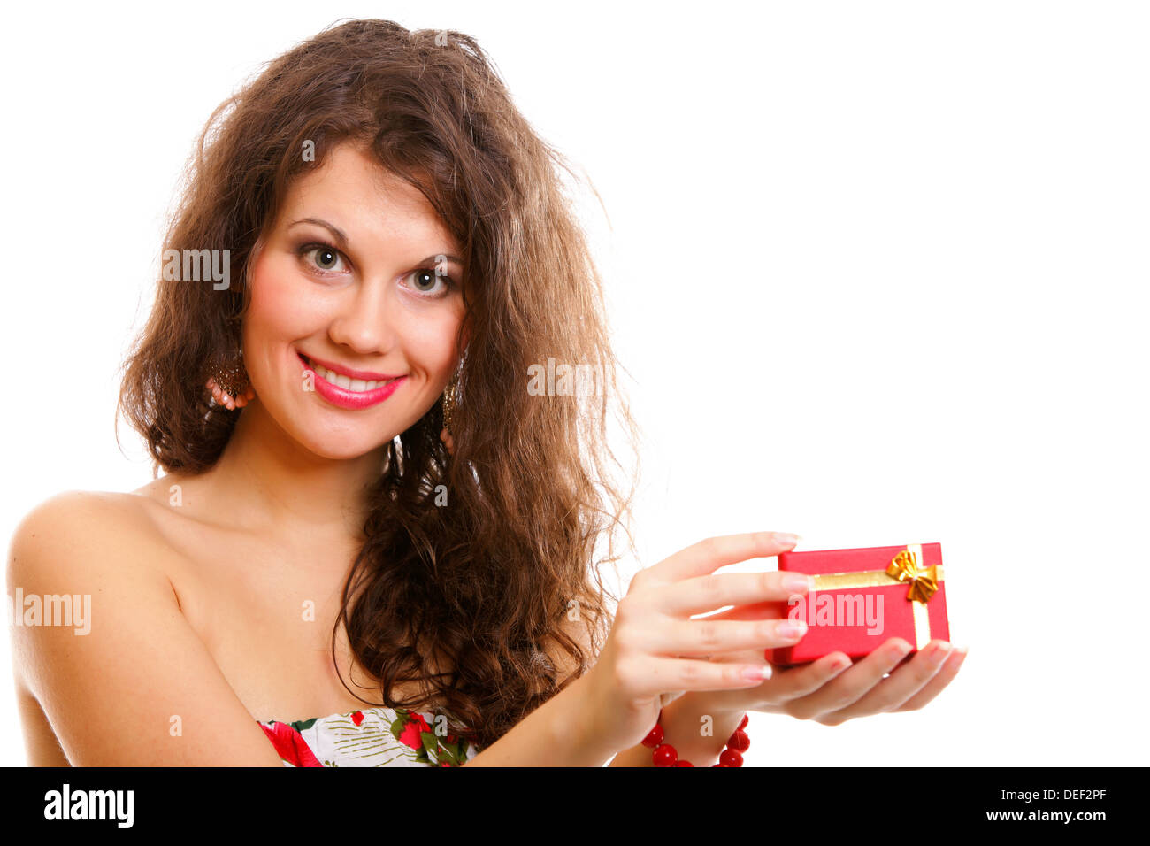 Girl opening small red gift box with gold bow isolated on white ...