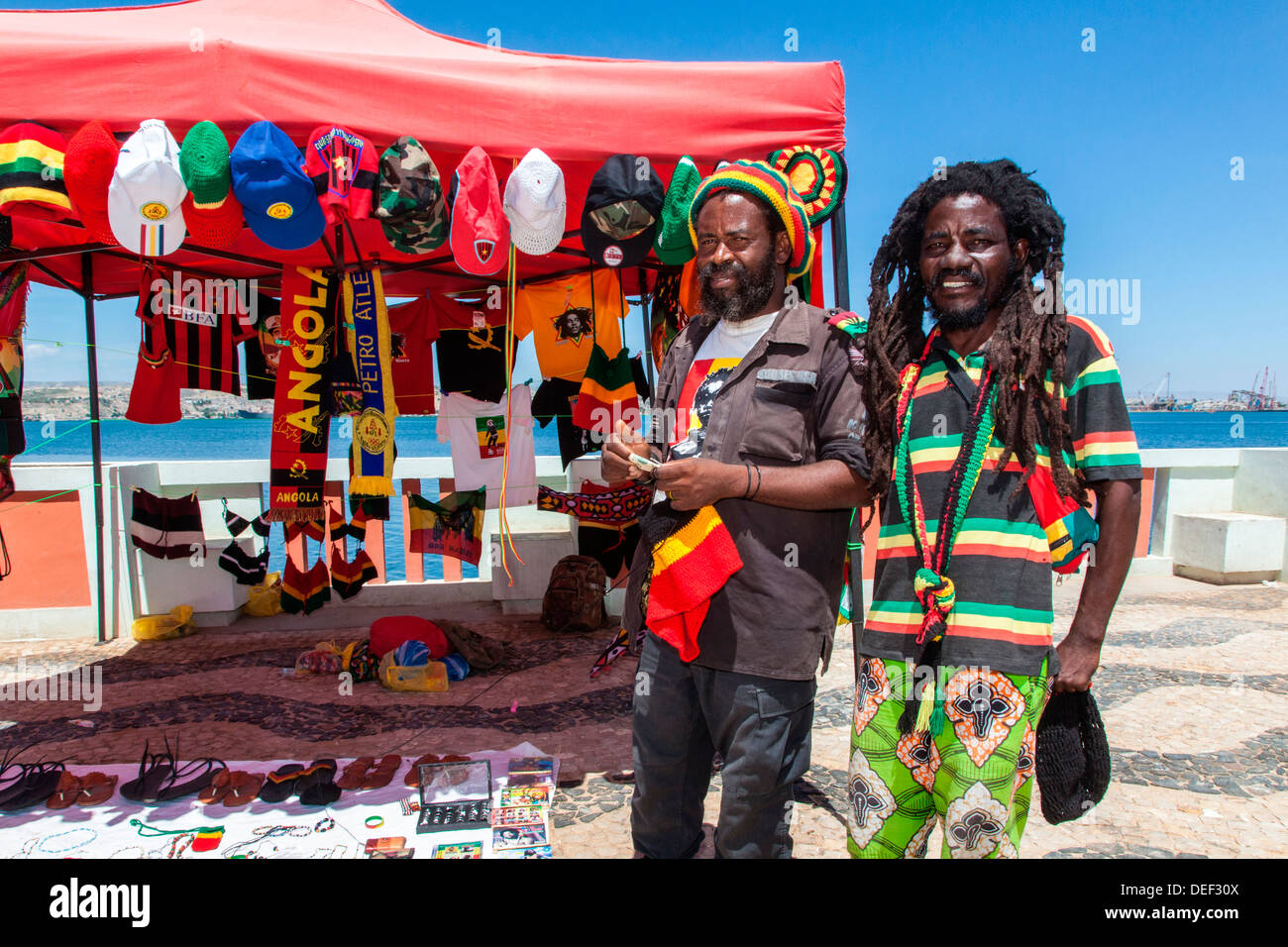Africa, Angola, Lobito. Rastafarian men at their streetside shop Stock ...