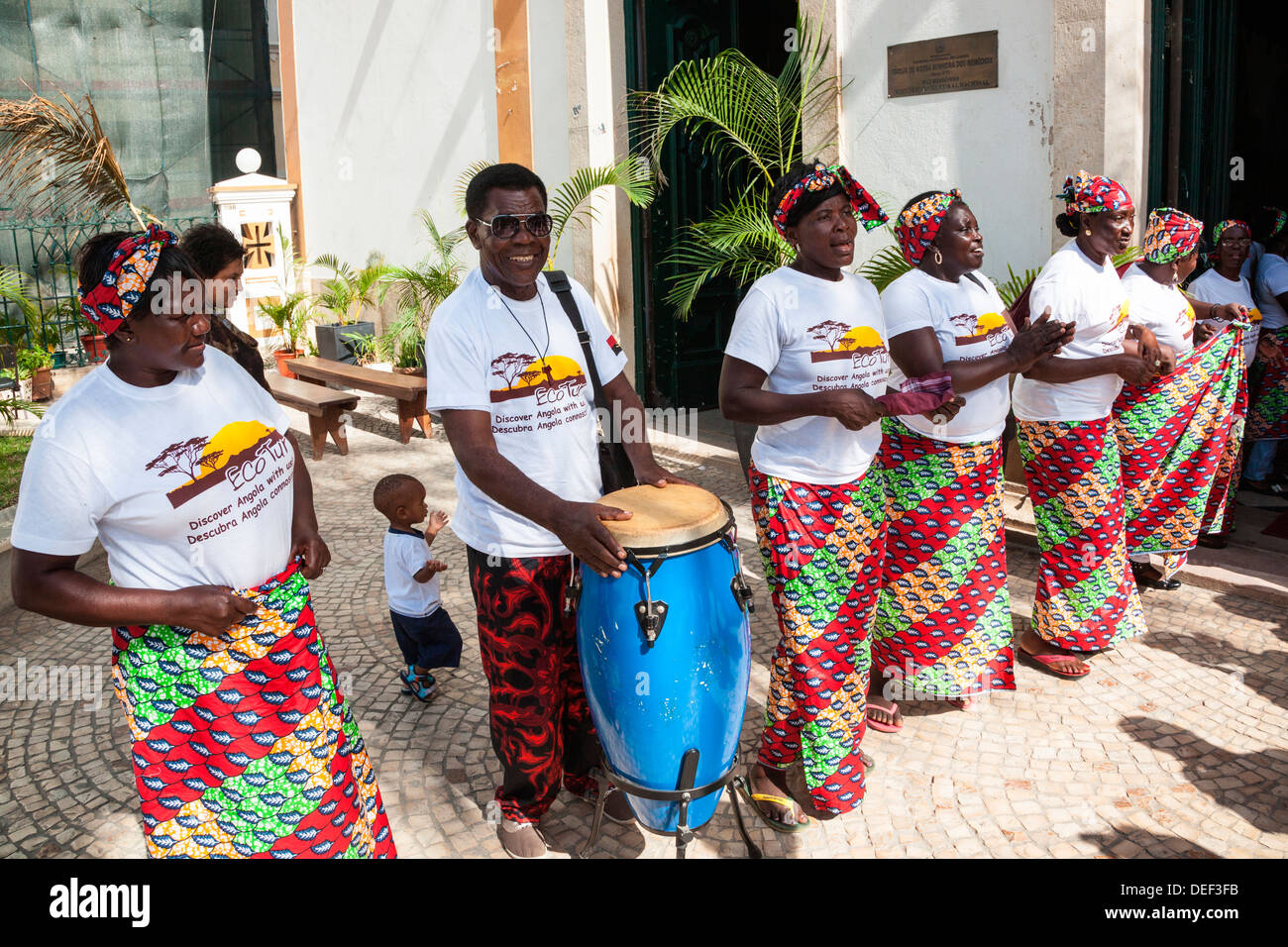 Africa, Angola, Luanda. Musicians drumming and singing outside of the ...