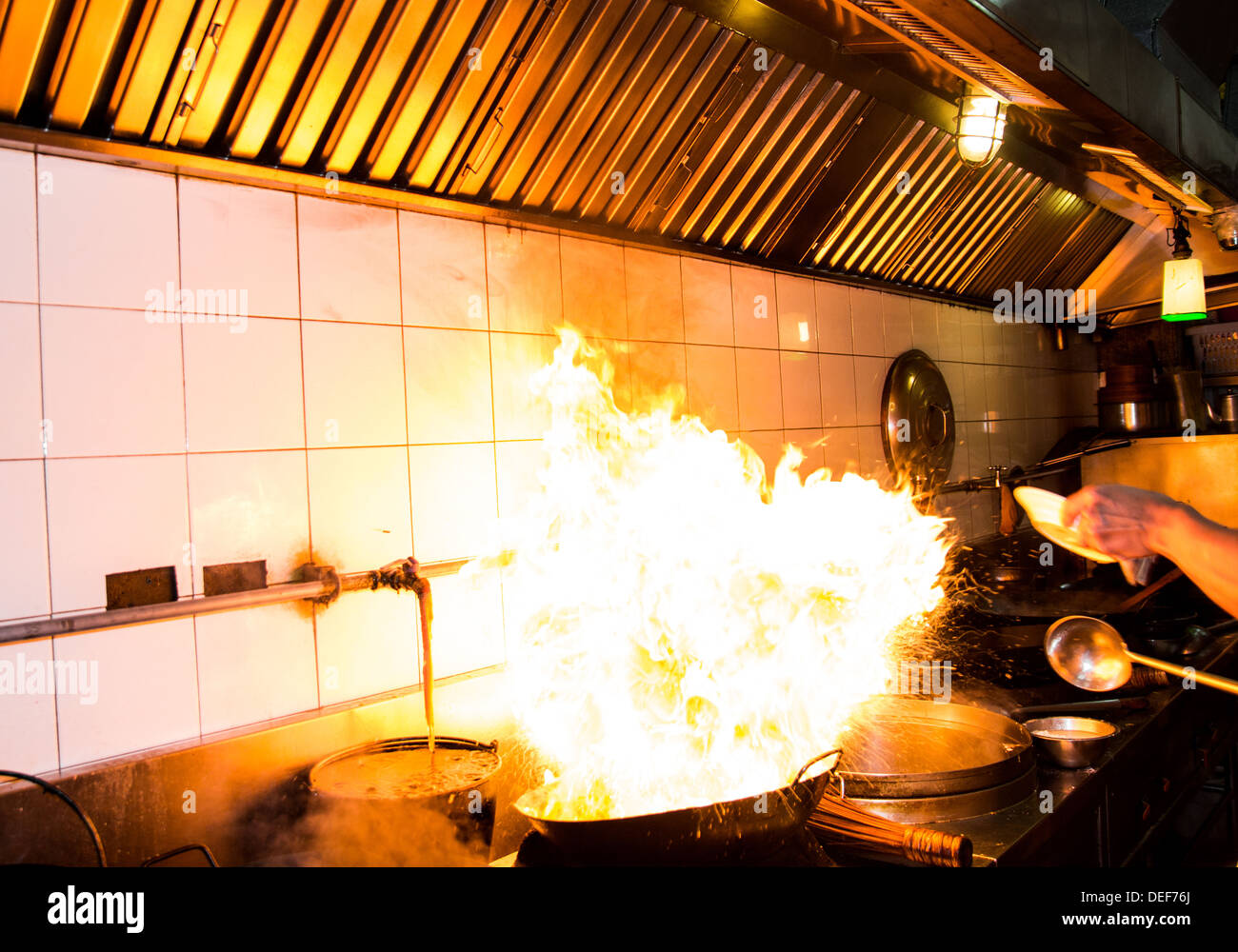 Fire gas burn is cooking on iron pan,stir fire very hot Stock Photo - Alamy