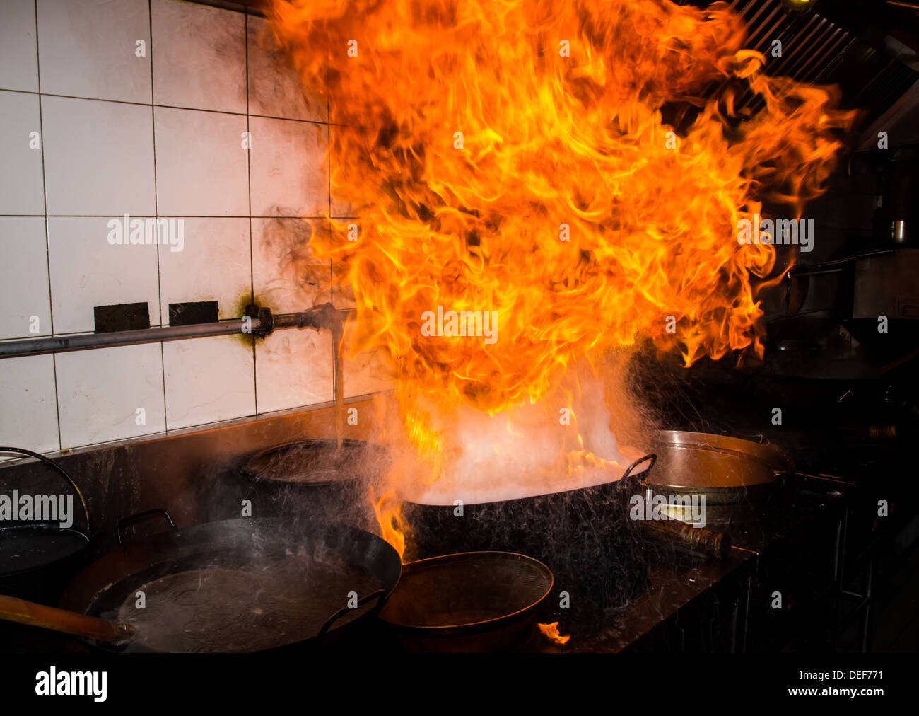 Fire gas burn is cooking on iron pan,stir fire very hot Stock Photo - Alamy