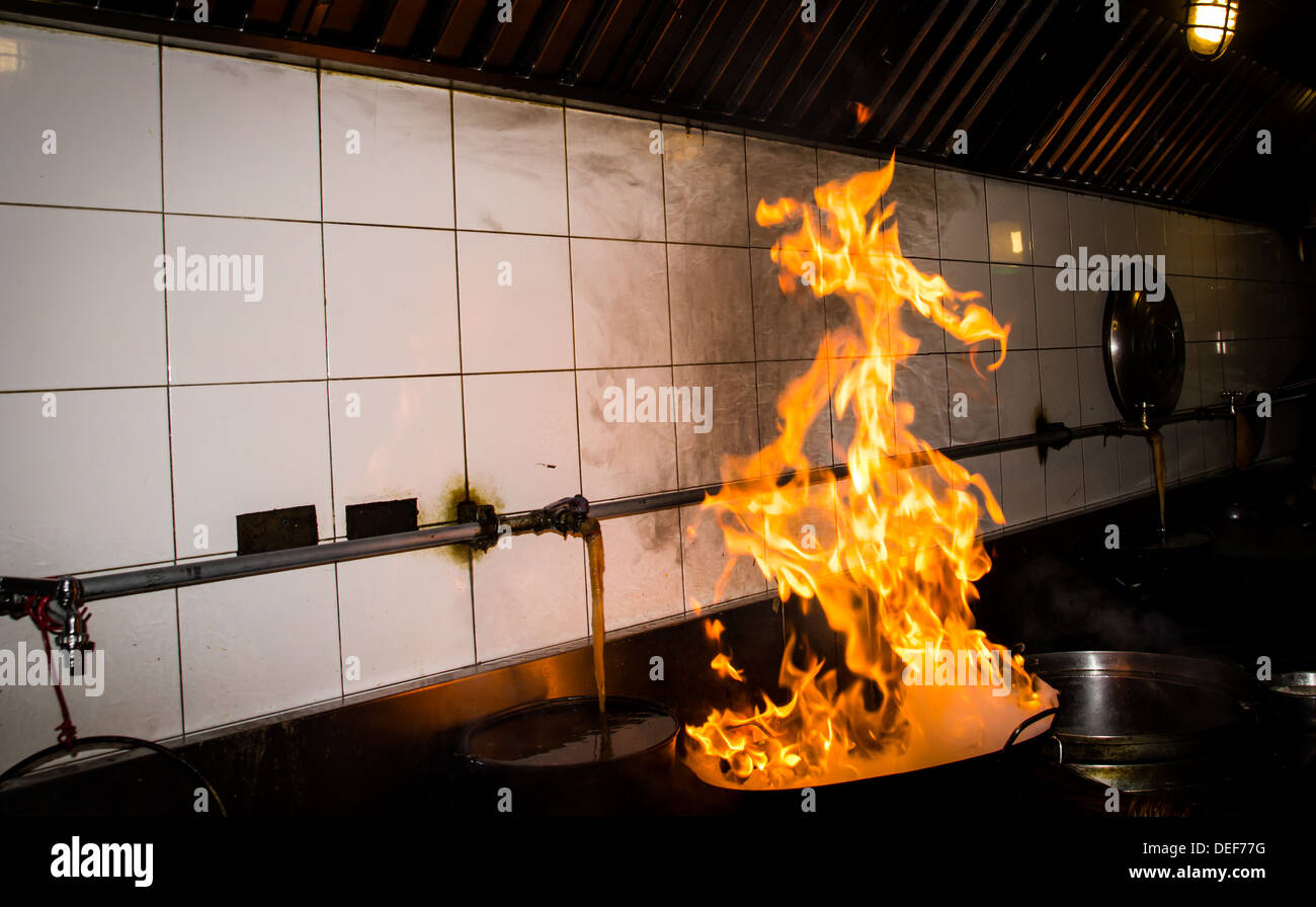 Fire gas burn is cooking on iron pan,stir fire very hot Stock Photo - Alamy