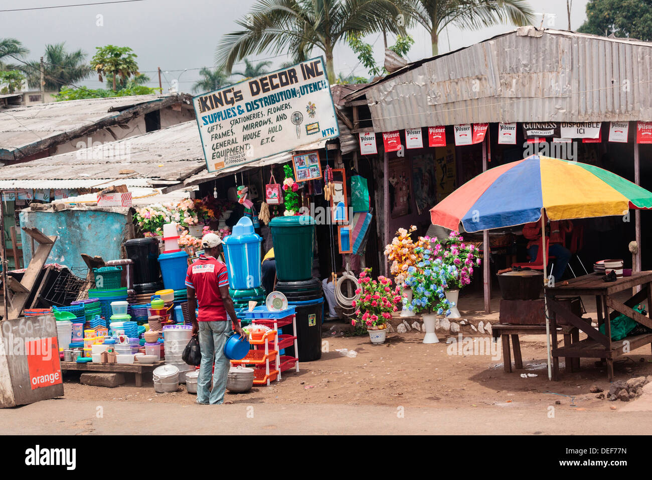Africa, Cameroon, Buea. Man standing outside store Stock Photo - Alamy