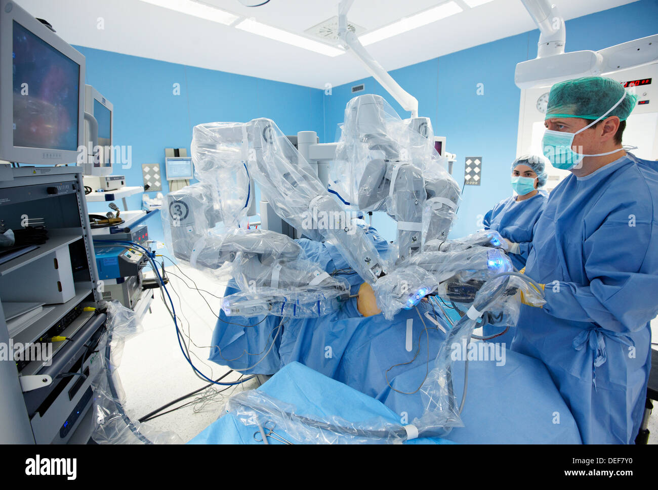 Woman surgeon operating da vinci system hi-res stock photography and ...