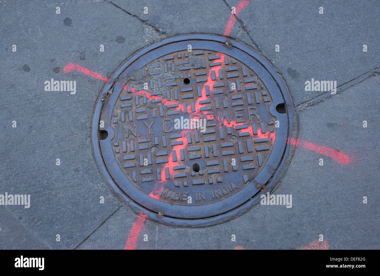 Manhole cover for access to the New York City sewer system Stock Photo ...