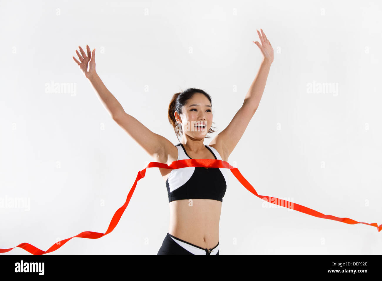 Young woman with finish line Stock Photo - Alamy
