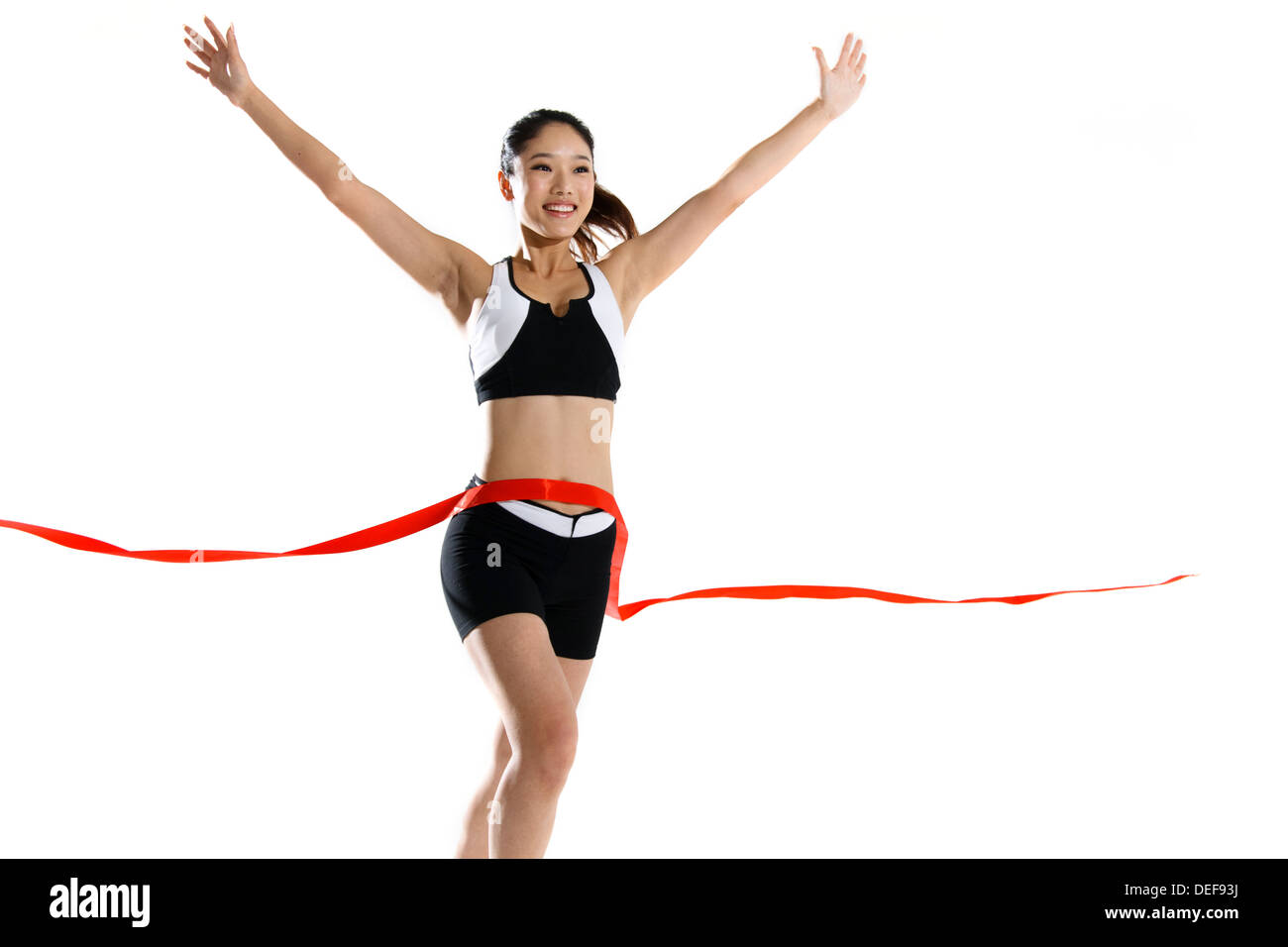 Young woman with finish line Stock Photo - Alamy