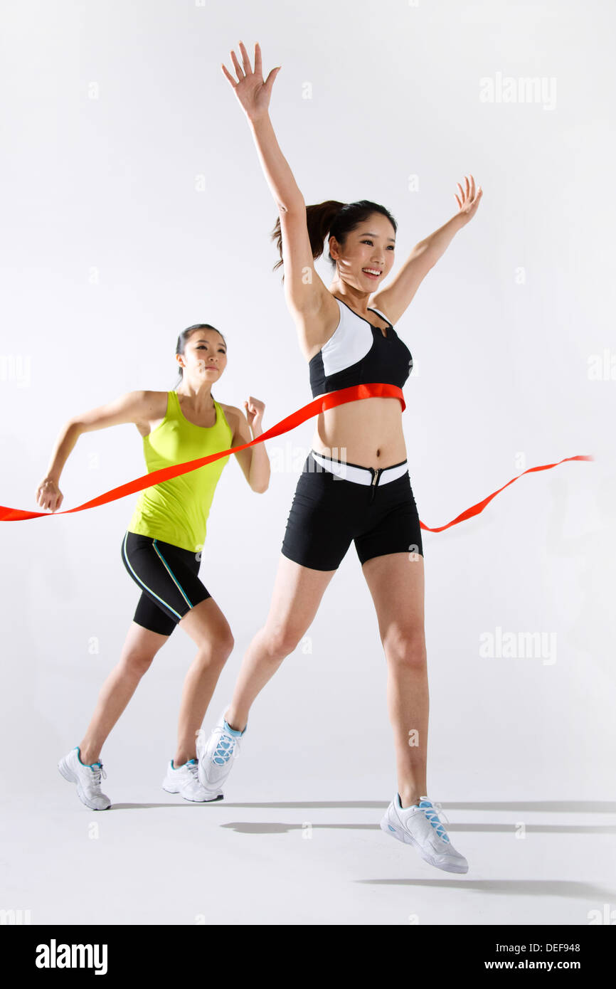 Young women with finish line Stock Photo - Alamy