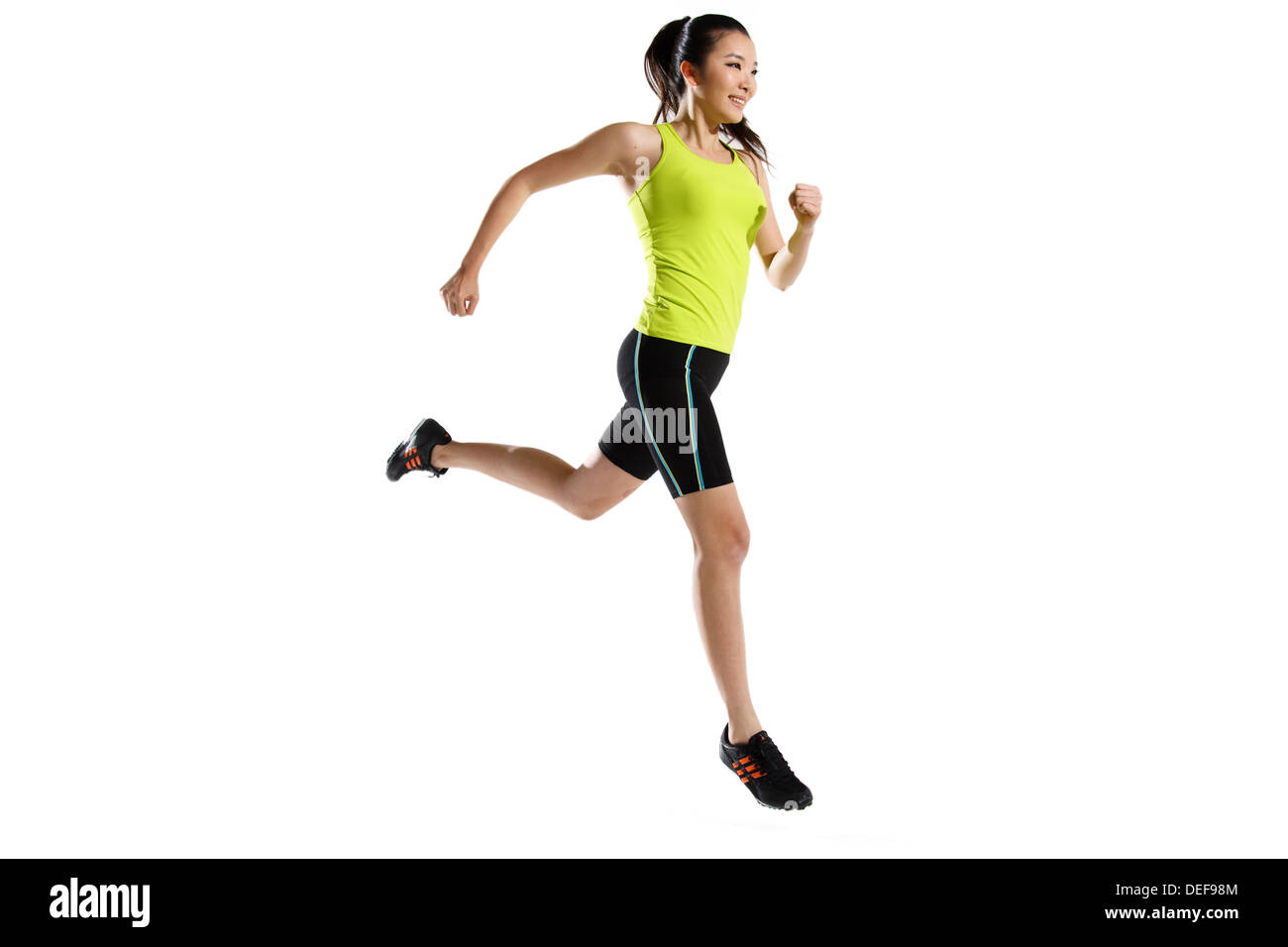Young woman jogging Stock Photo - Alamy