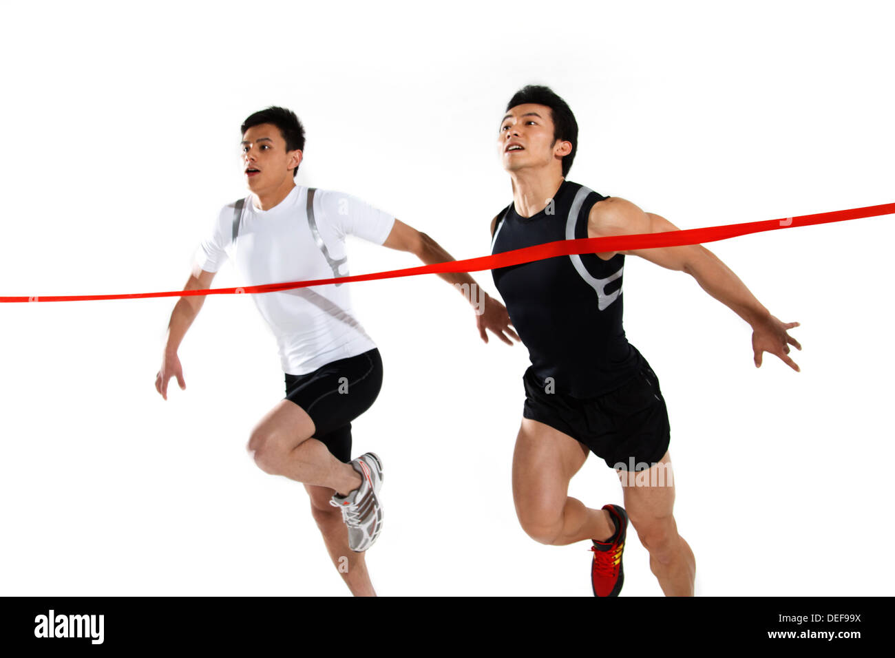 Young athletes with finish line Stock Photo - Alamy