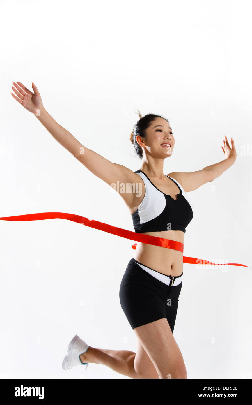 Young woman with finish line Stock Photo - Alamy