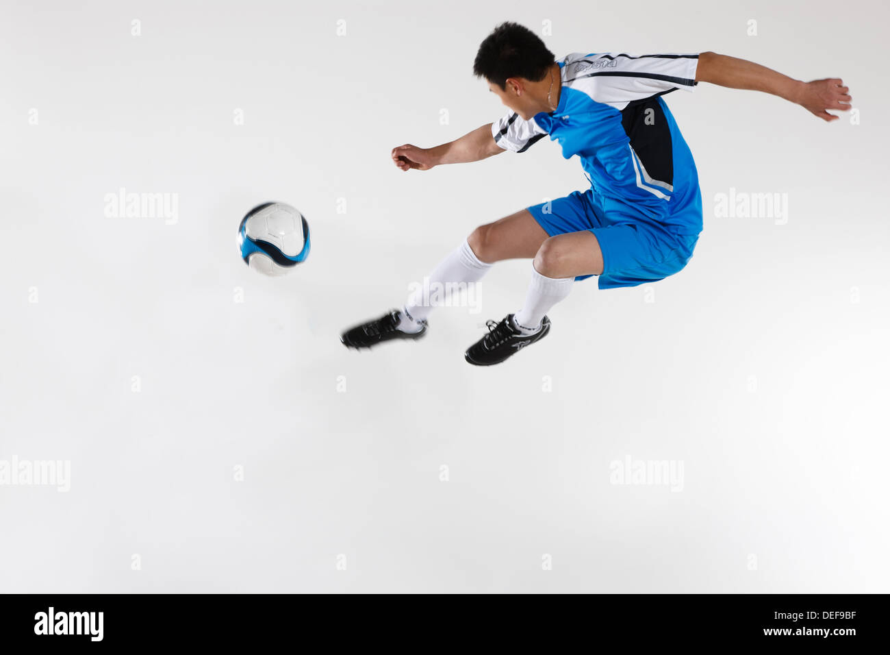 Two young men playing football Stock Photo - Alamy