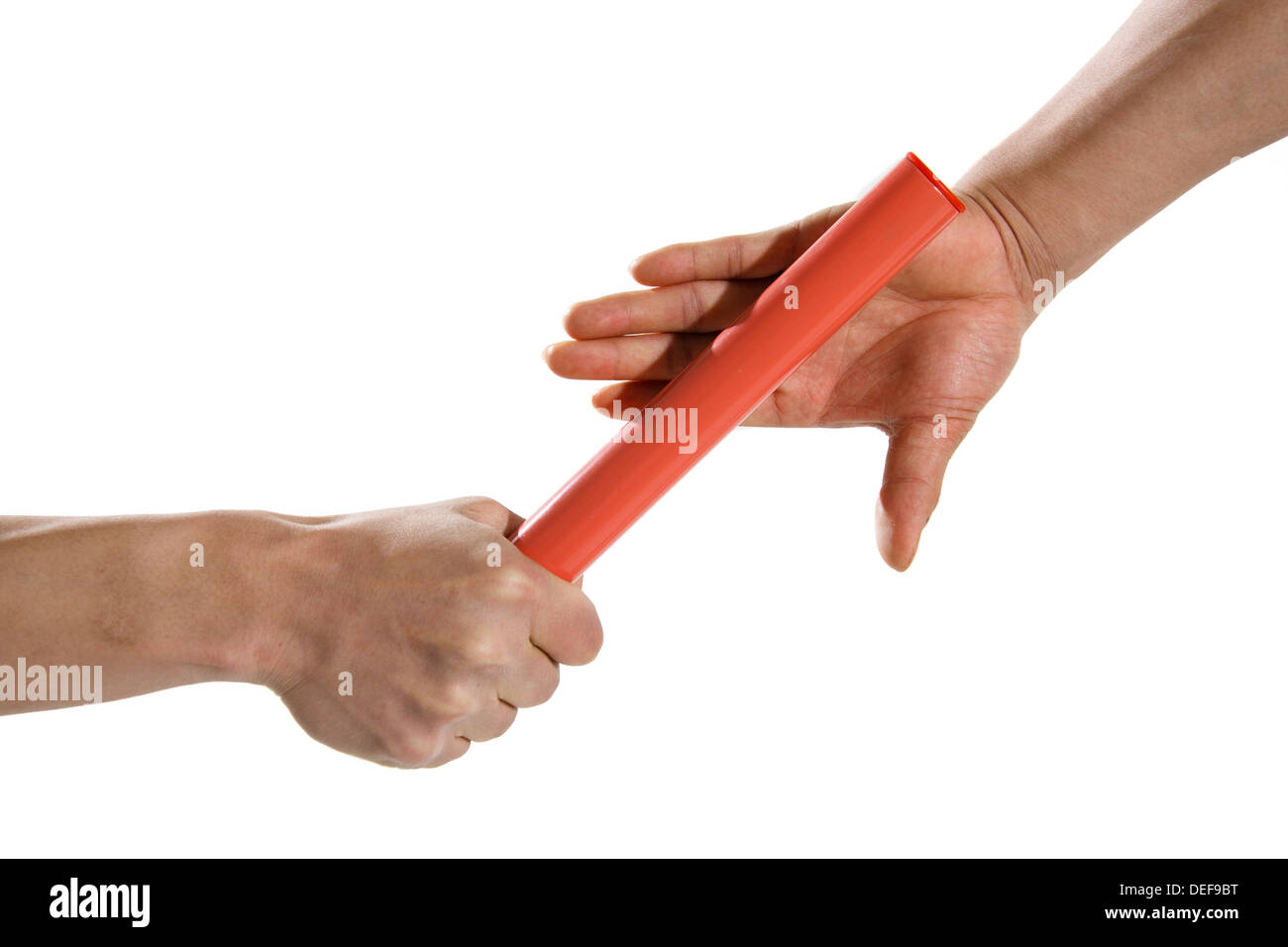 Close-up of relay baton being passed Stock Photo - Alamy
