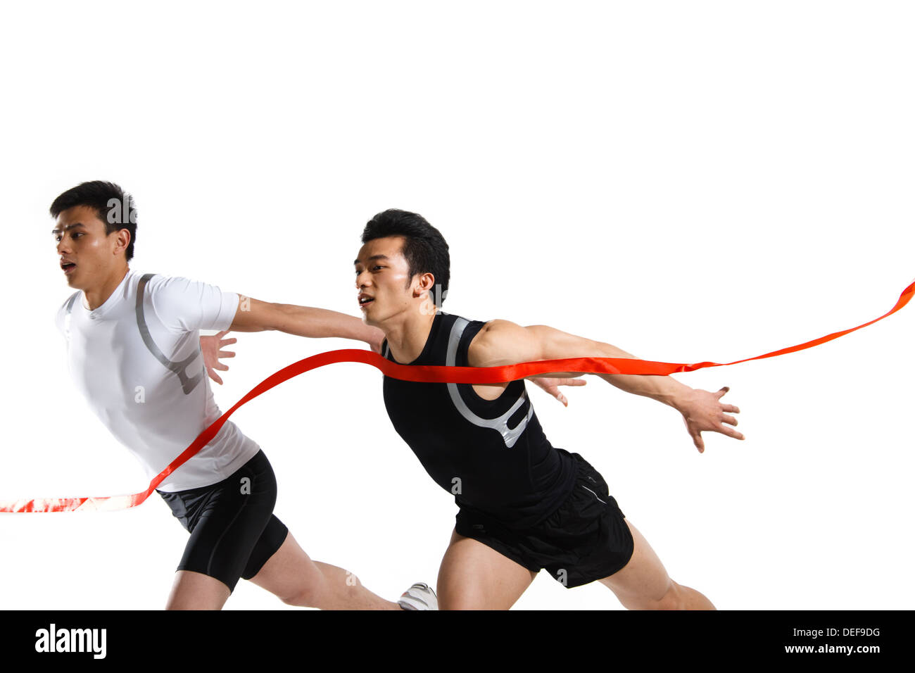 Young athletes with finish line Stock Photo - Alamy