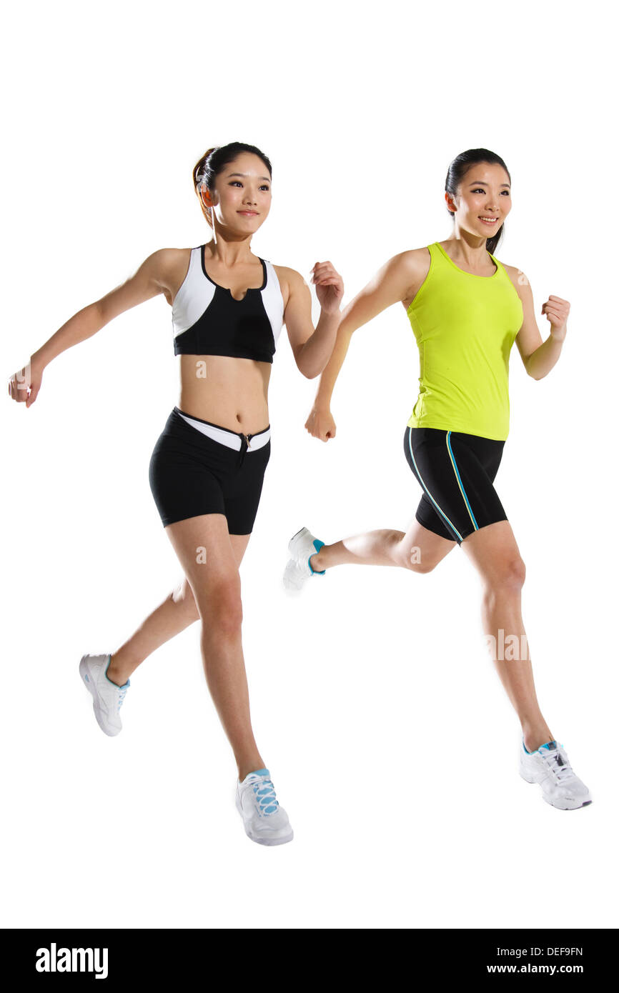 Two young women white Cut Out Stock Images & Pictures - Alamy