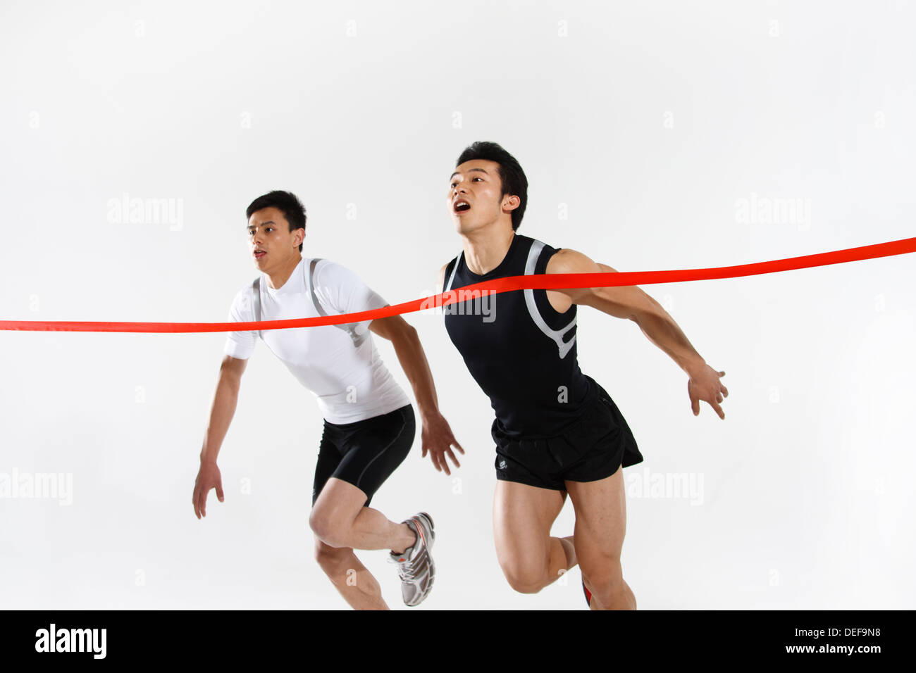 Young athletes with finish line Stock Photo - Alamy