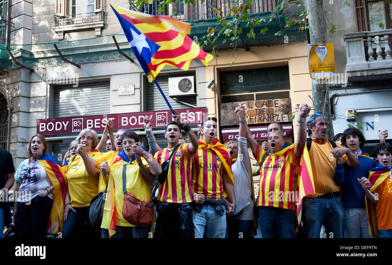 Catalans forming a human chain and cheering on National Catalonia day ...