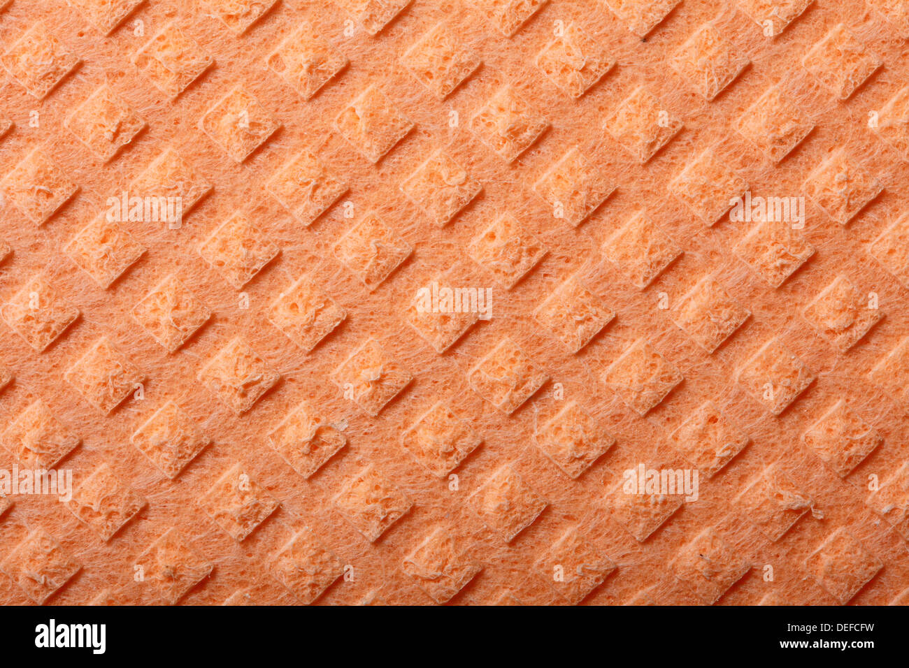 Orange kitchen sponge rubber foam as background texture Stock Photo - Alamy