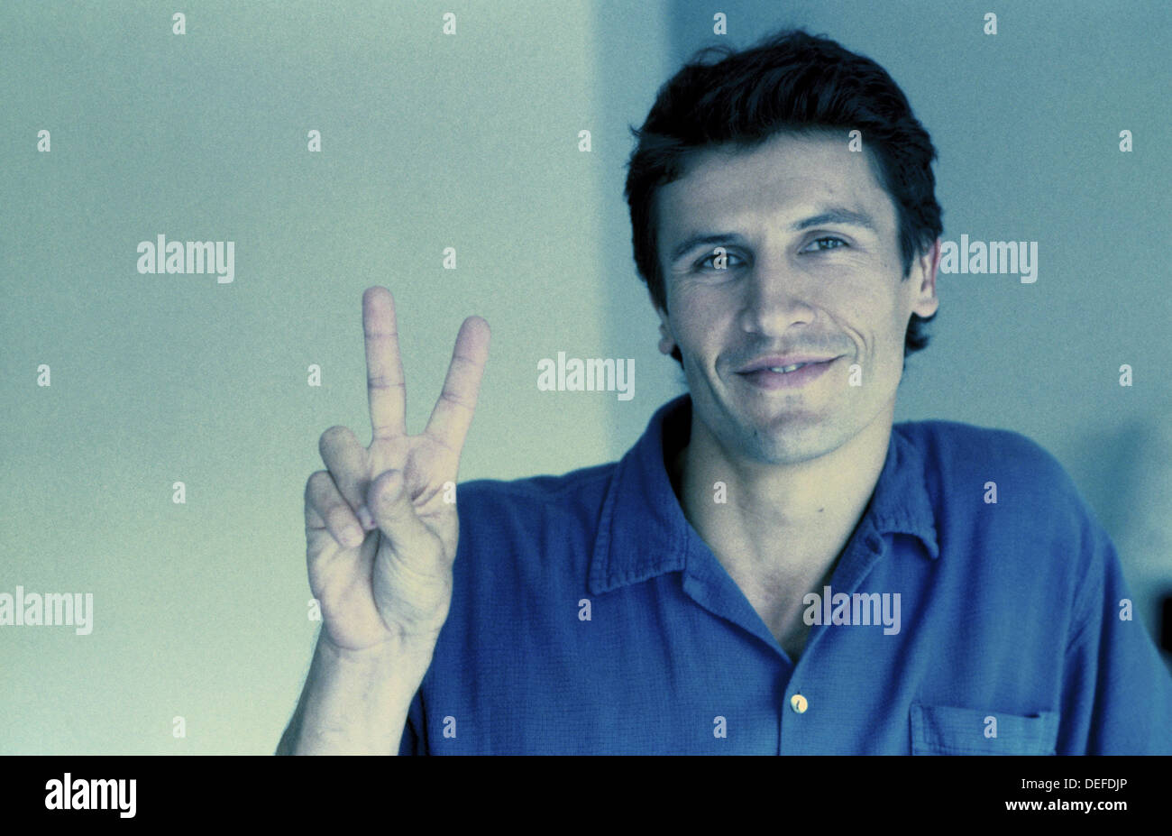 Man giving peace sign hi-res stock photography and images - Alamy