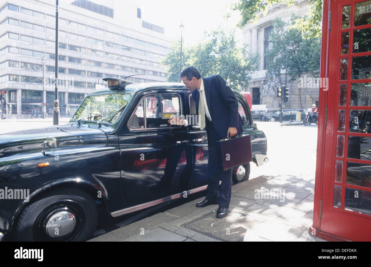 Businessman getting cab hi-res stock photography and images - Alamy
