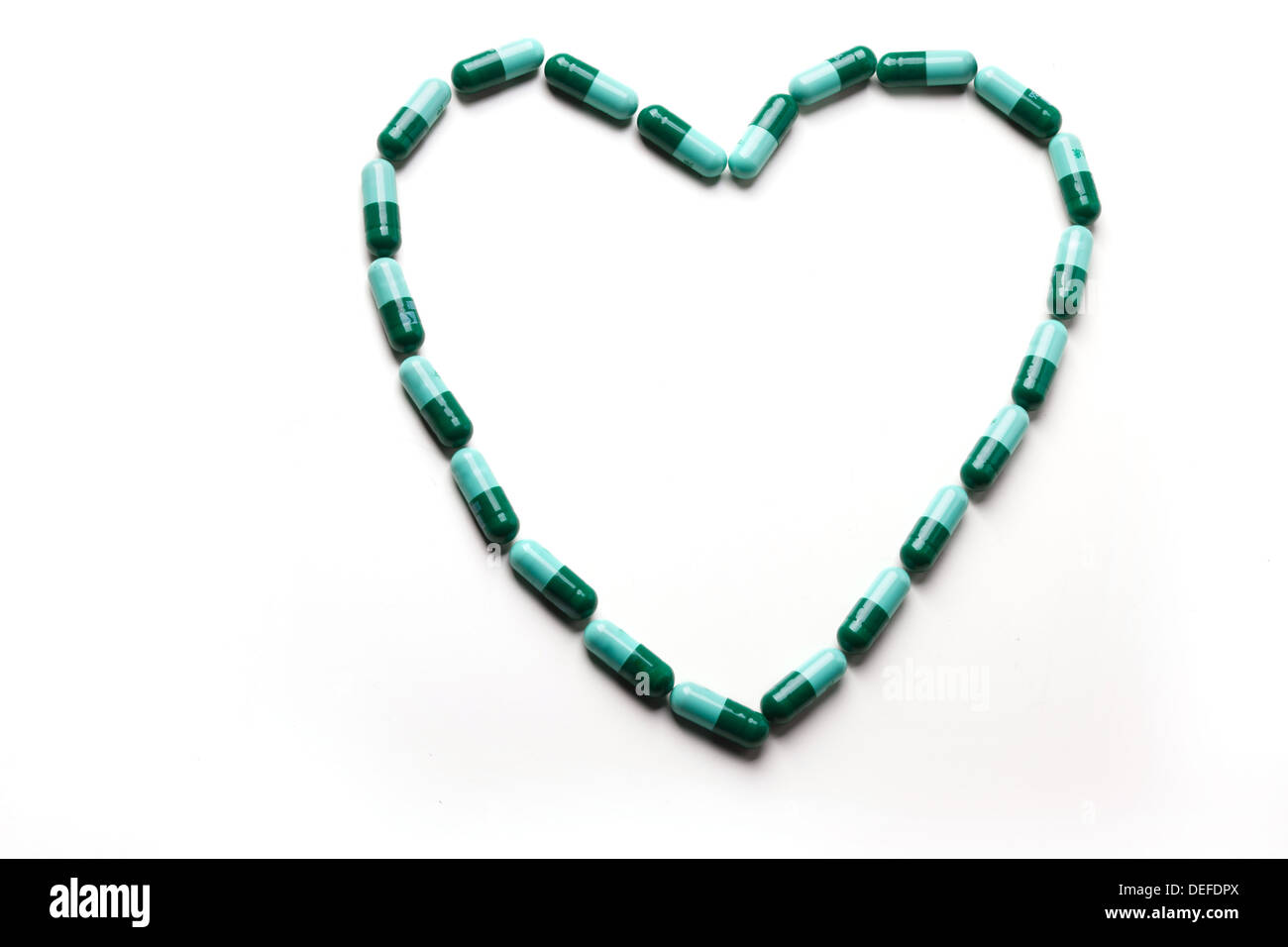 Capsules creating a heart shape Stock Photo - Alamy