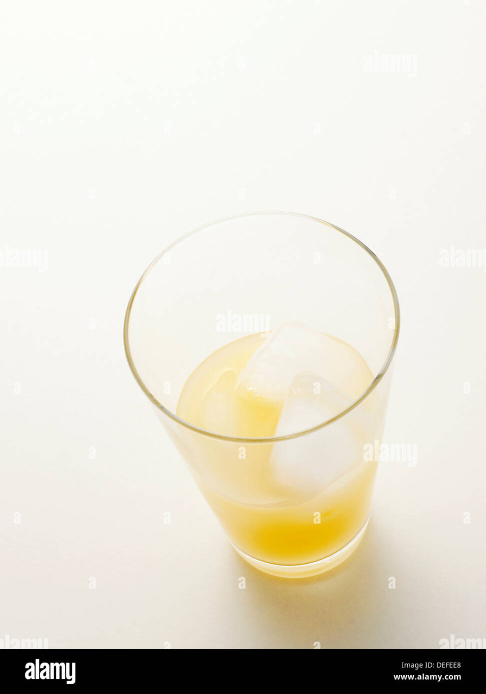 Glass of Pernod with ice cubes Stock Photo - Alamy