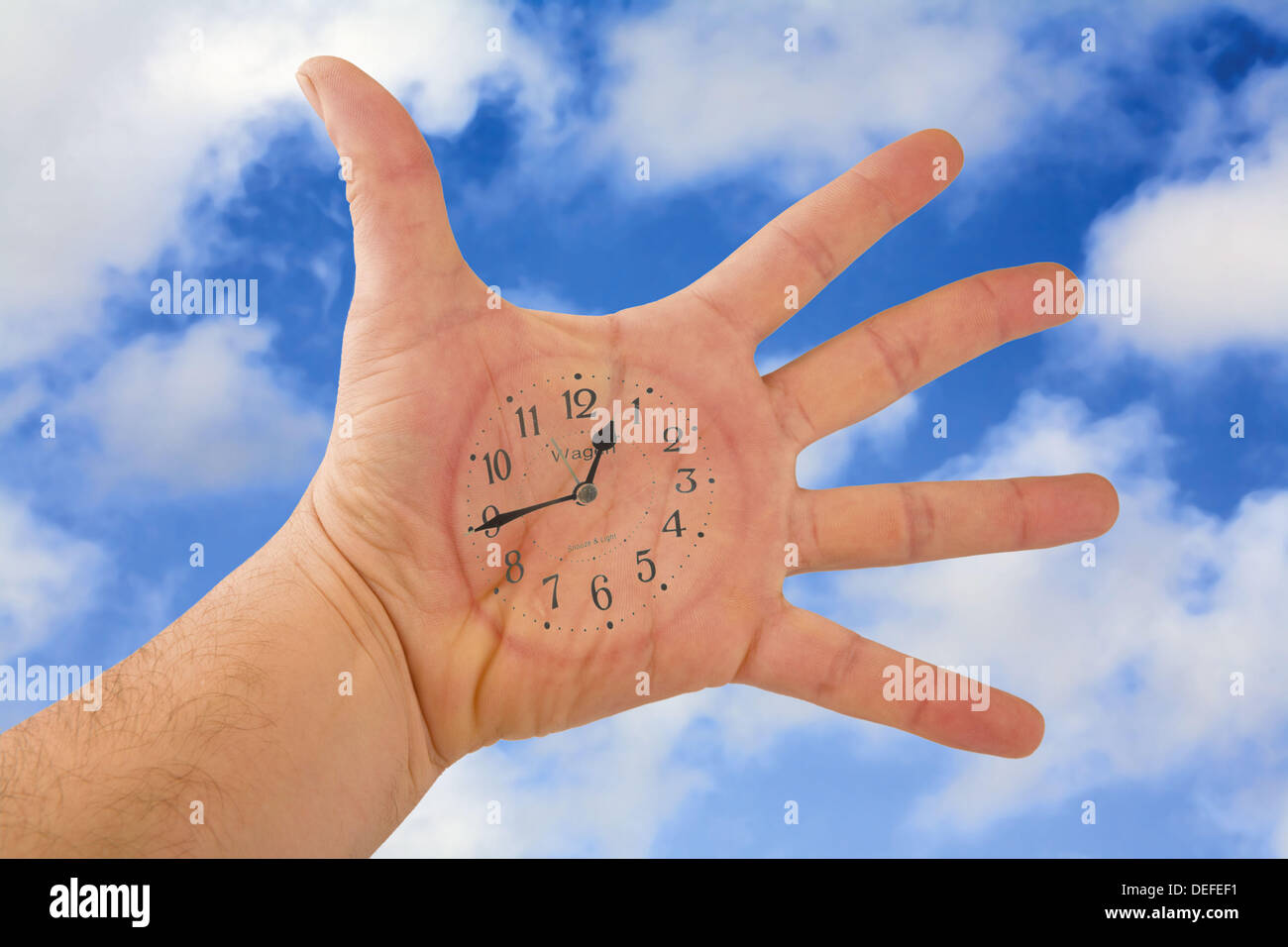 Hand and clock hi-res stock photography and images - Alamy