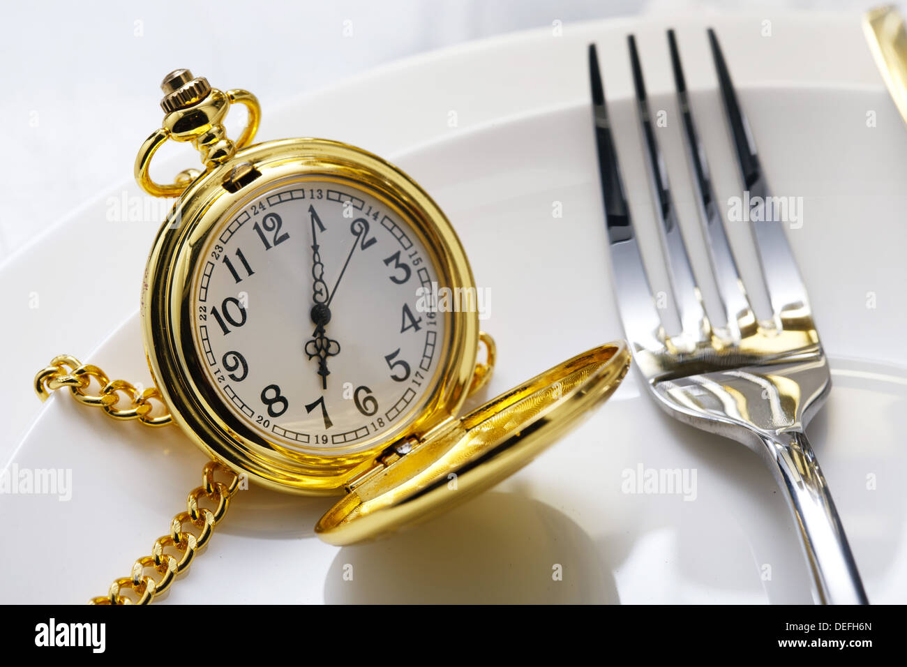 Fork and pocket clock hi-res stock photography and images - Alamy