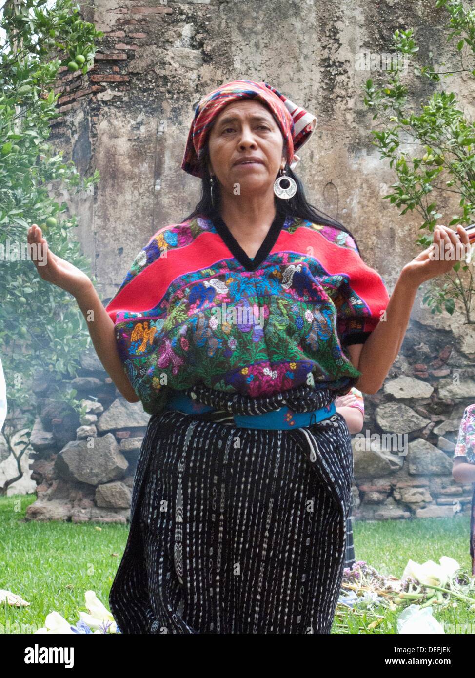 Indigenous woman praying during Maya ceremony Stock Photo - Alamy