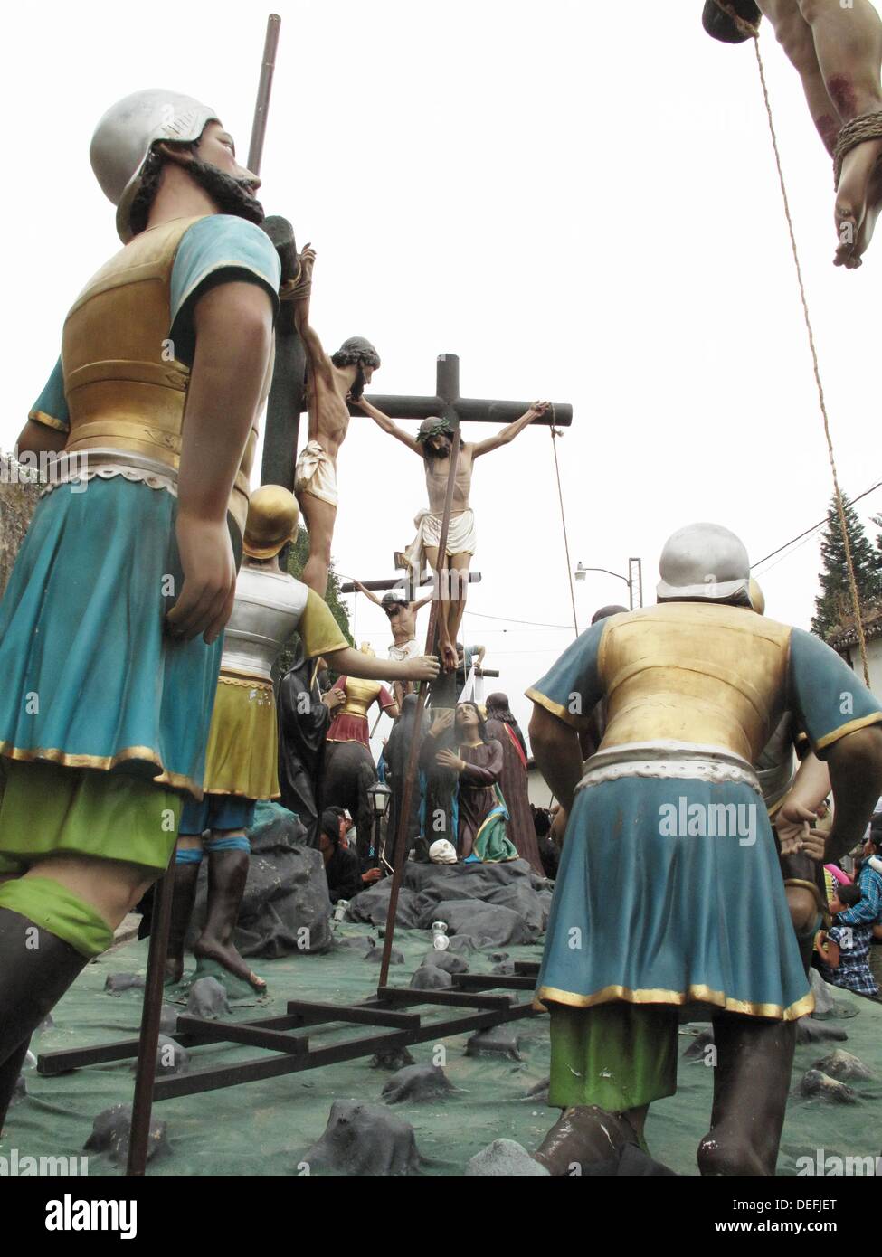 Statues of Roman soldiers next to crucifix on a float Stock Photo - Alamy