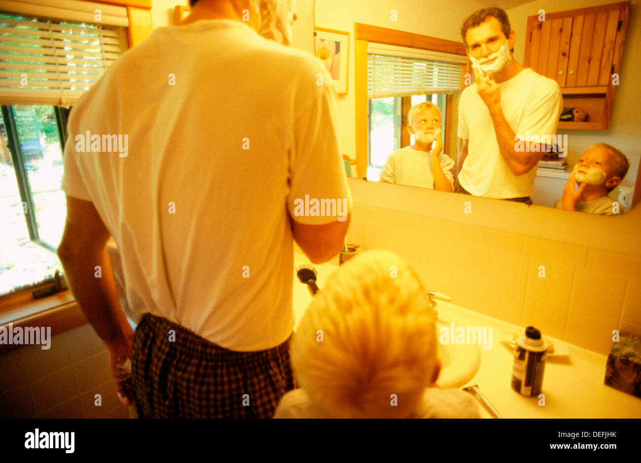 Son imitating dad hi-res stock photography and images - Alamy