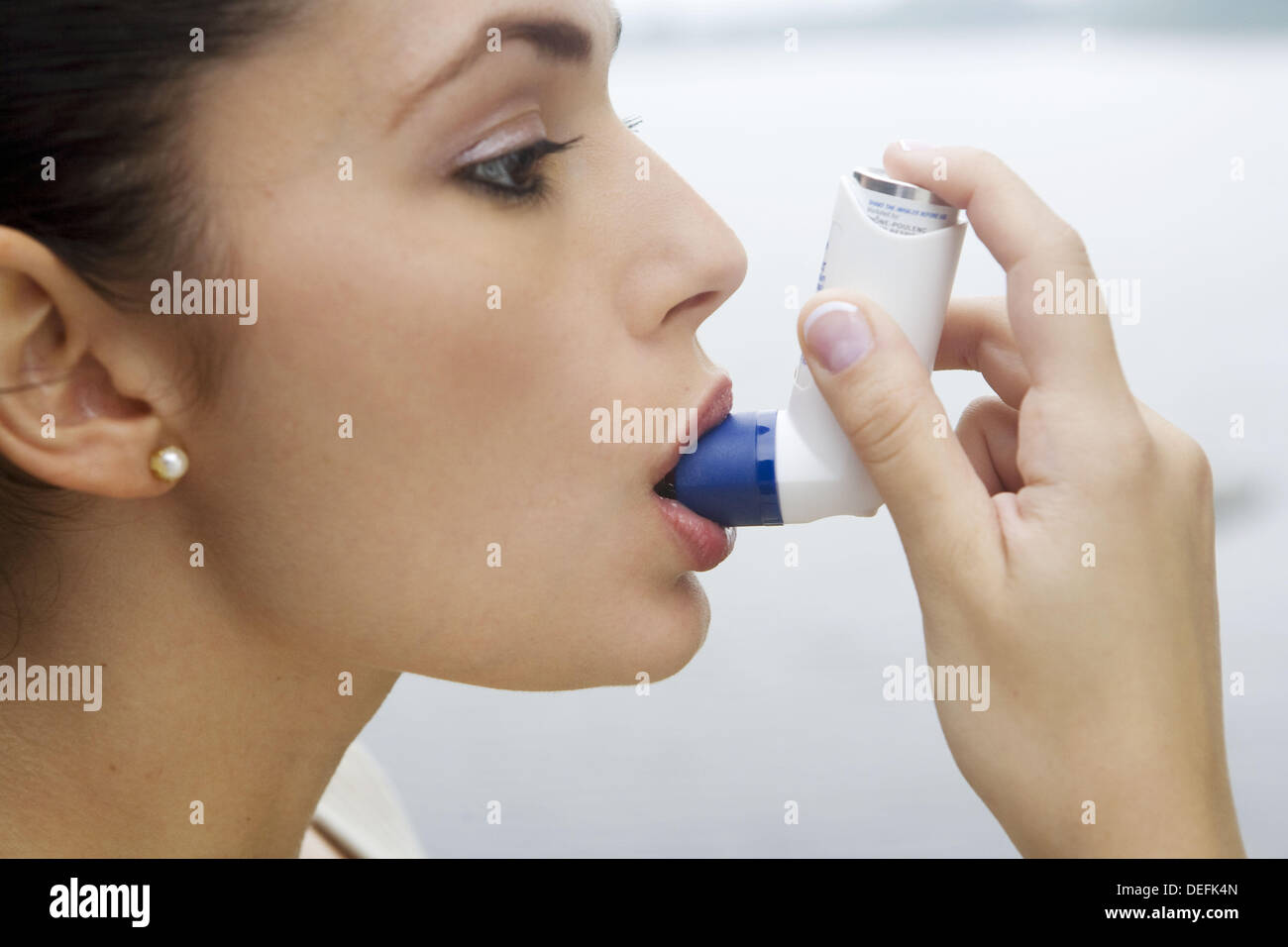 Hispanic female asthma inhaler hi-res stock photography and images - Alamy