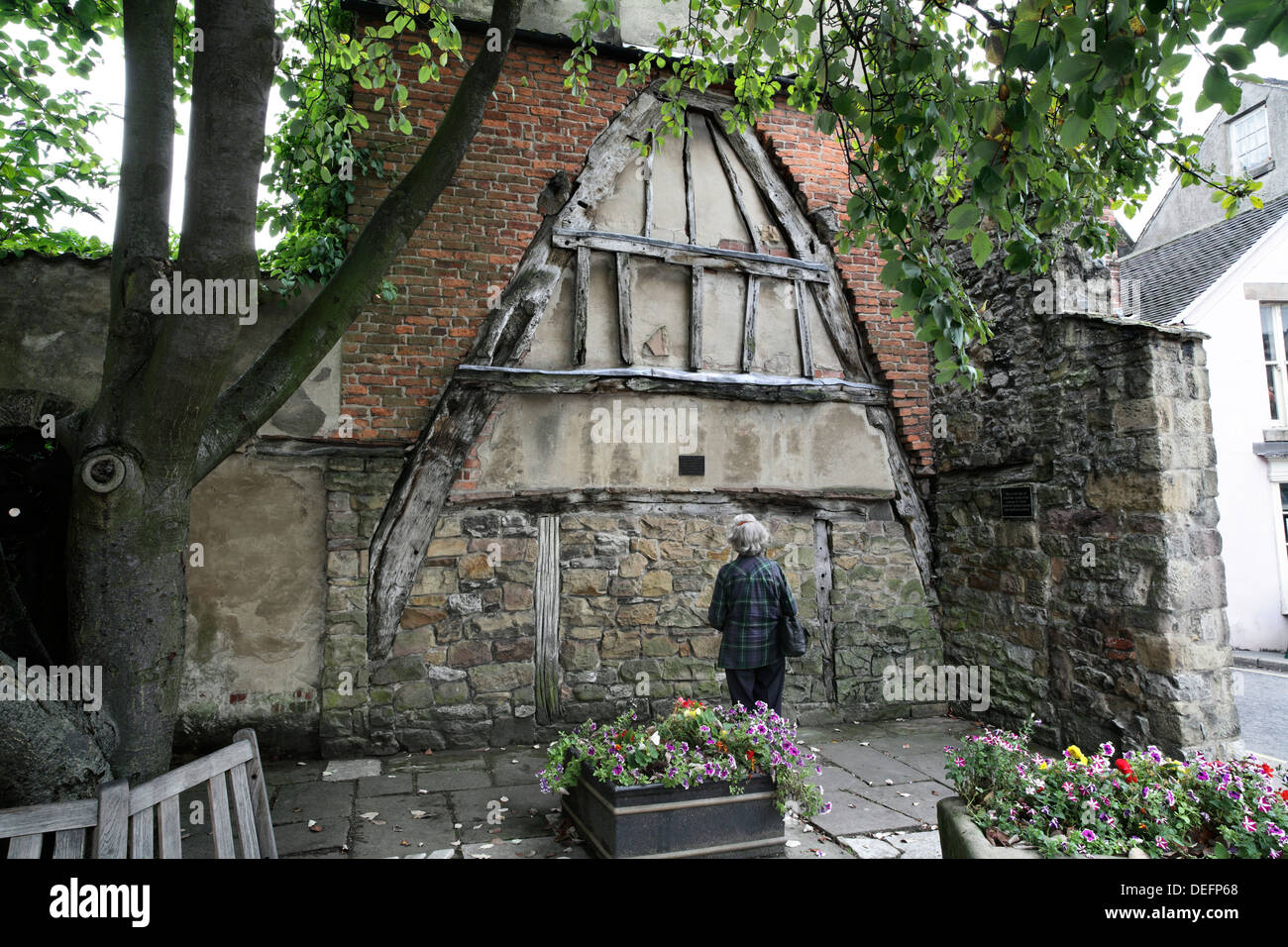 A wooden cruck remaining from the demolition of an old medieval ...