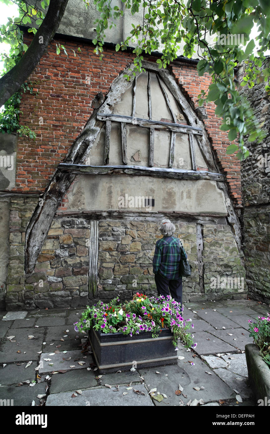 A wooden cruck remaining from the demolition of an old medieval ...