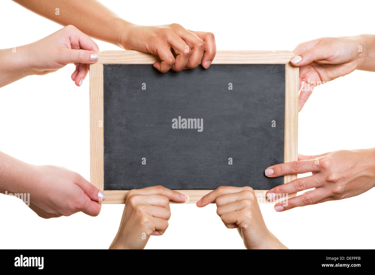 Many multicultural hands holding empty black chalkboard Stock Photo - Alamy