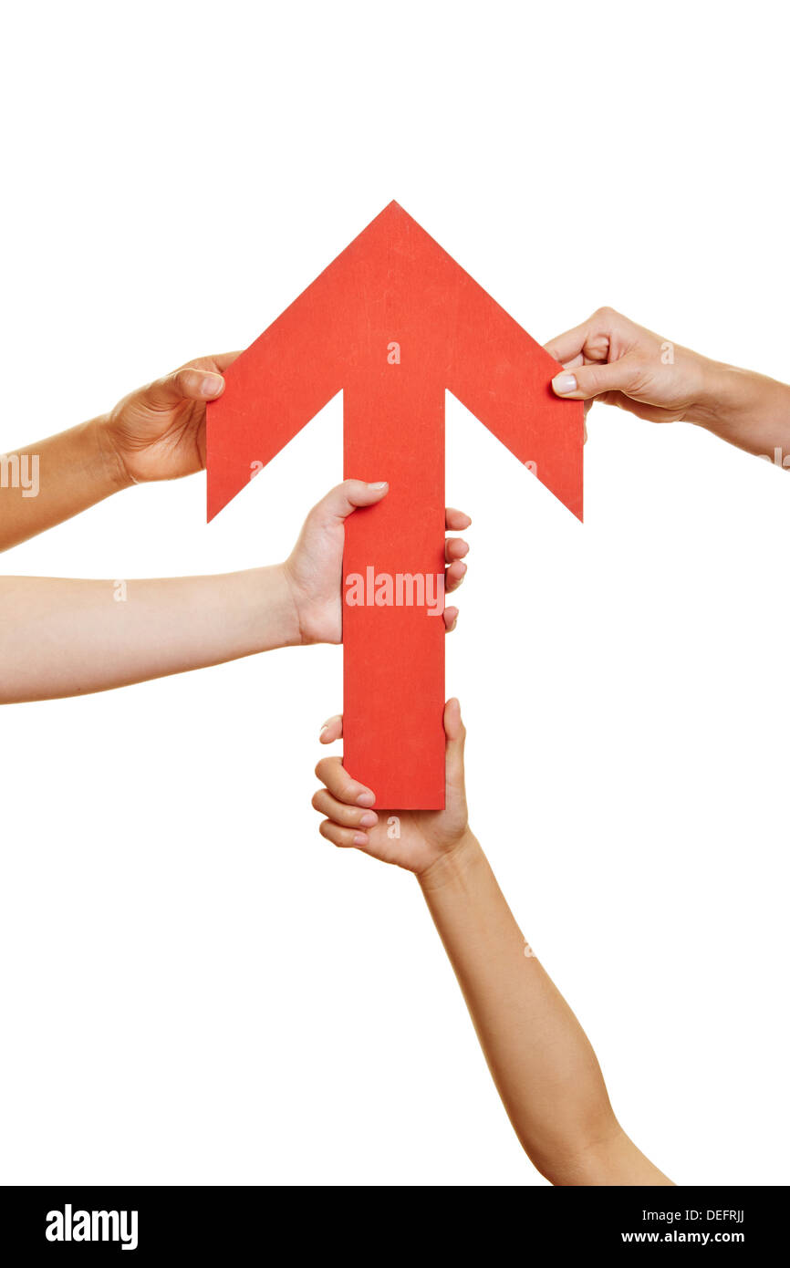 Many hands holding a red arrow pointing up Stock Photo - Alamy