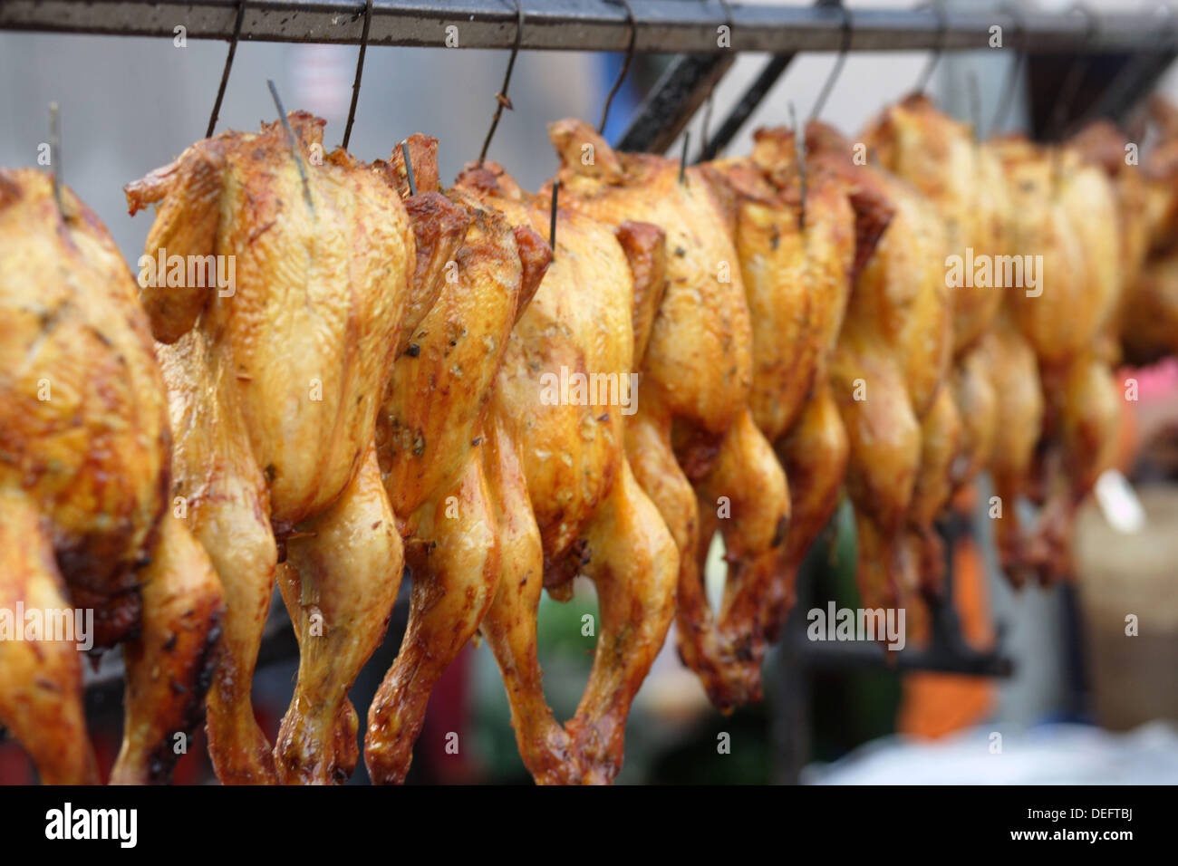 Hanging roast chicken hi-res stock photography and images - Alamy