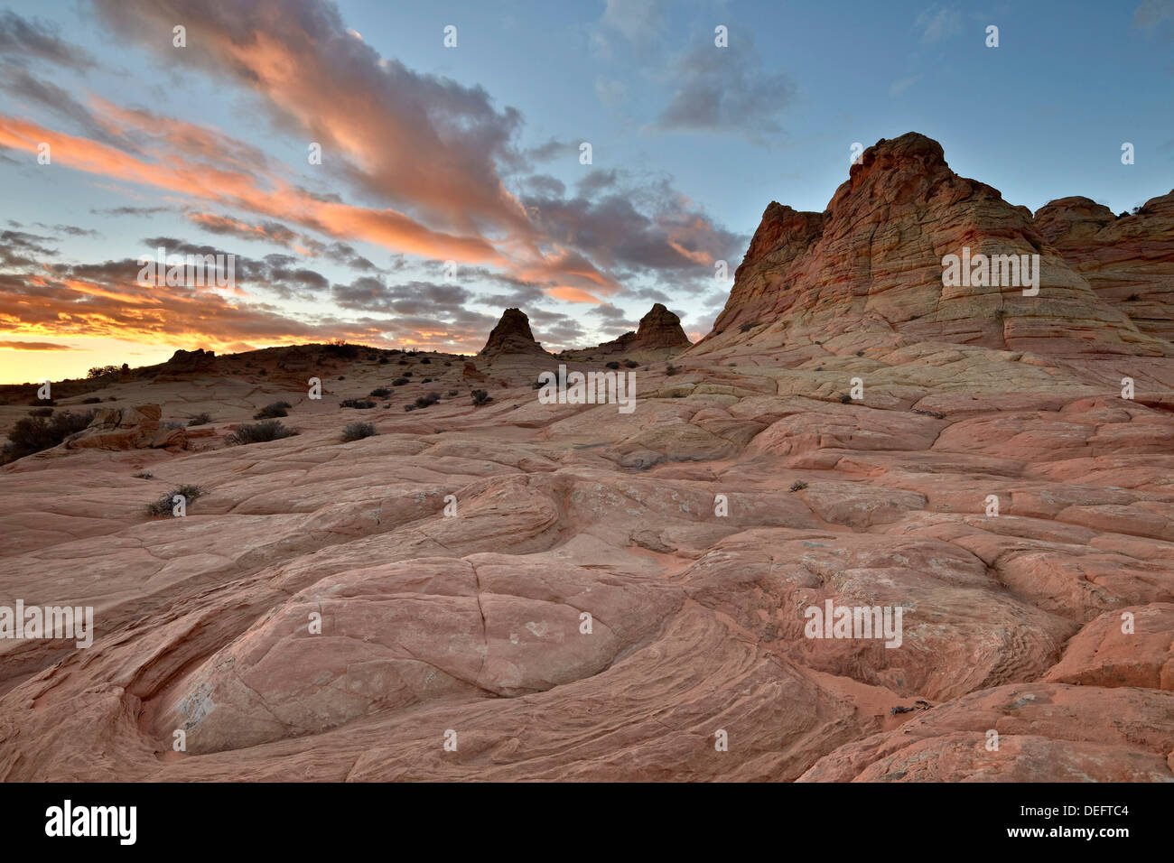 Orange clouds at sunrise above sandstone formations, Coyote Buttes ...