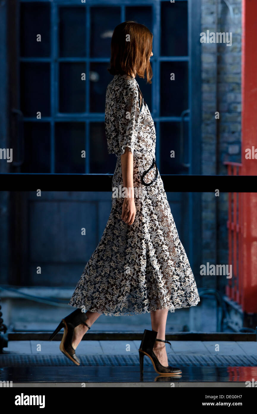 A model wears a design created by Christopher Kane during London ...