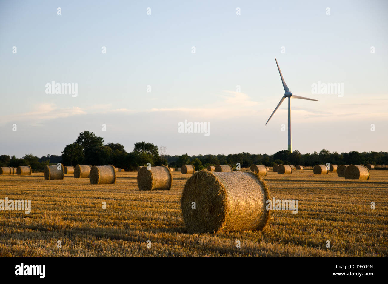 Renewable energy symbolized by straw bales and a windmill Stock Photo ...