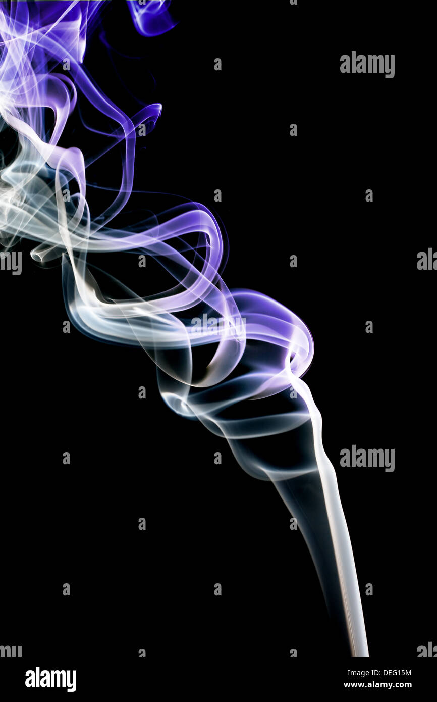 Abstract violet smoke. Isolated on a black background Stock Photo - Alamy