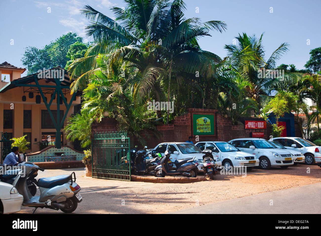 Vehicles parked outside a tourist resort, Lemon Tree Amarante Beach ...
